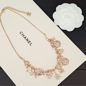 CHANEL | Jewelry | Chanel Gold And Pink Charm Necklace | Poshmark